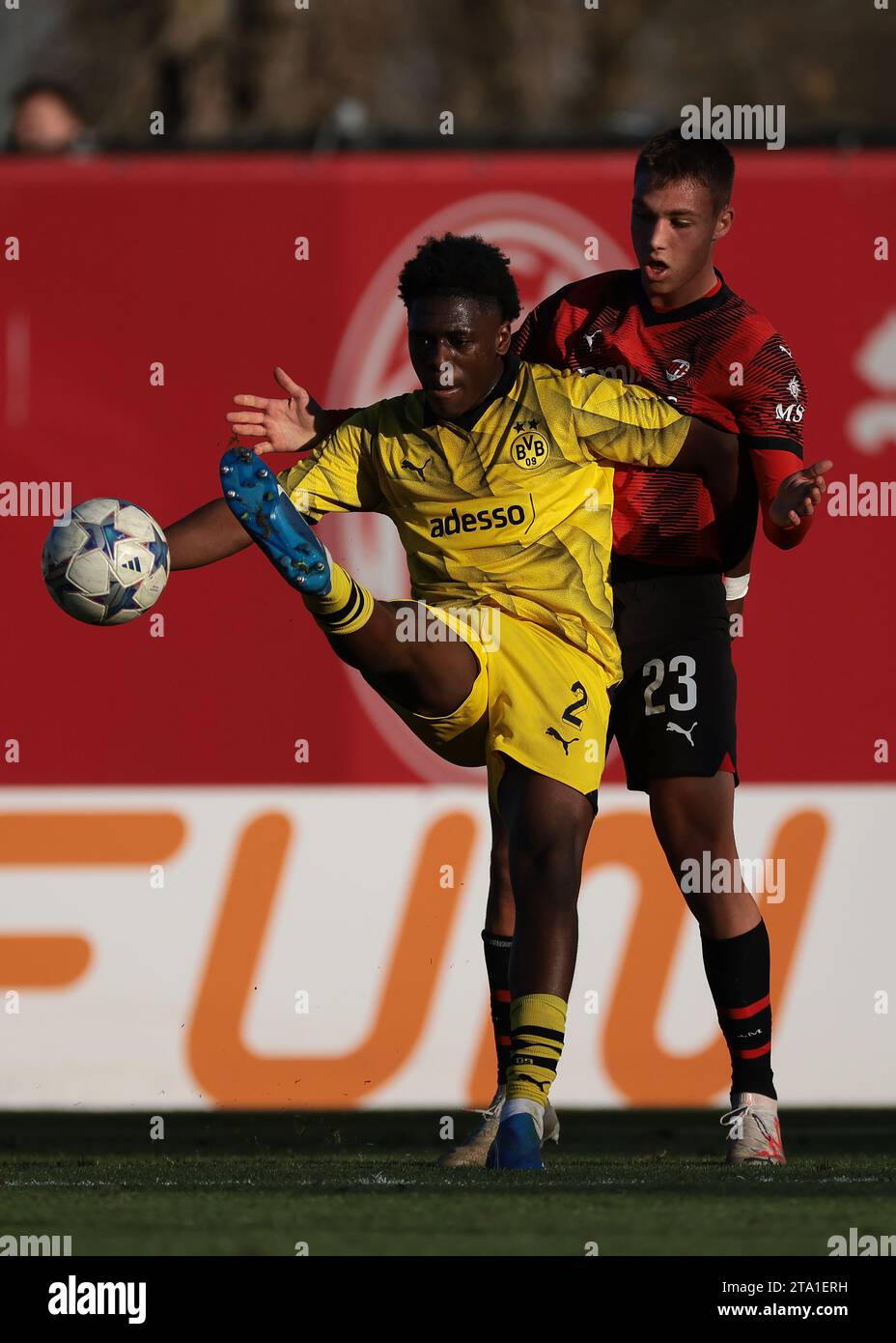 Milan, Italy. 28th Nov, 2023. Vittorio Magni of AC Milan tussles with ...