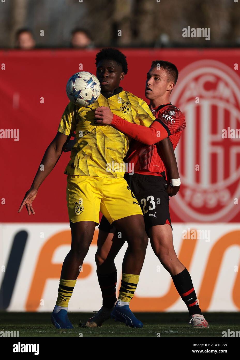 Milan, Italy. 28th Nov, 2023. Vittorio Magni of AC Milan tussles with ...