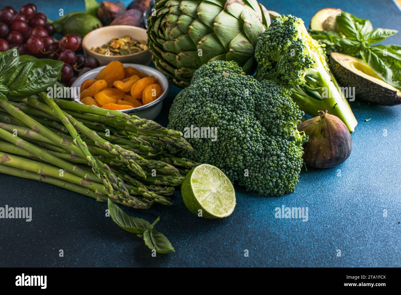 Variety of fresh raw organic fruits and vegetables. Health foods high ...