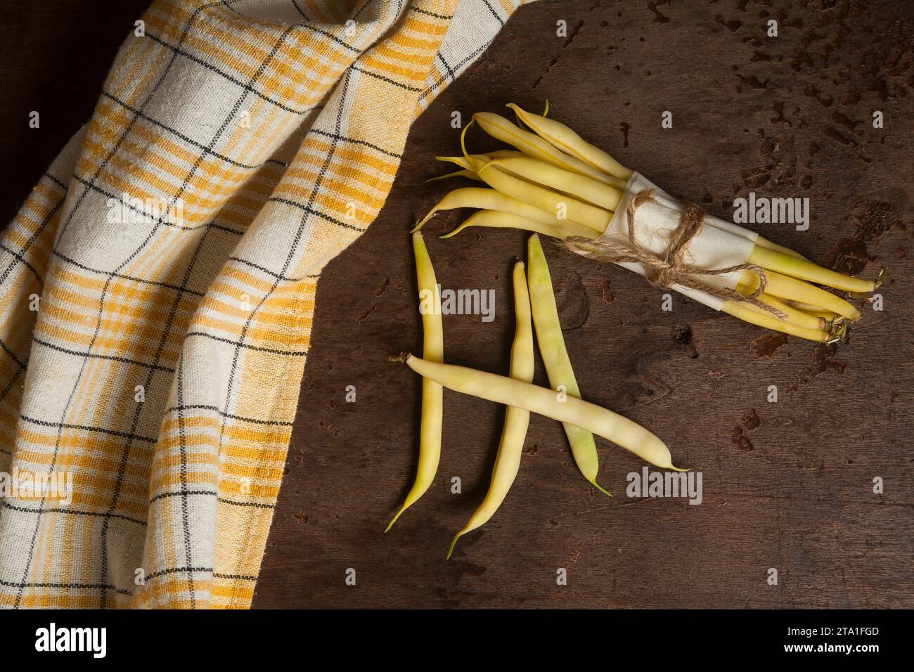 Bunch and several pods of raw yellow pods of haricot with yellow ...