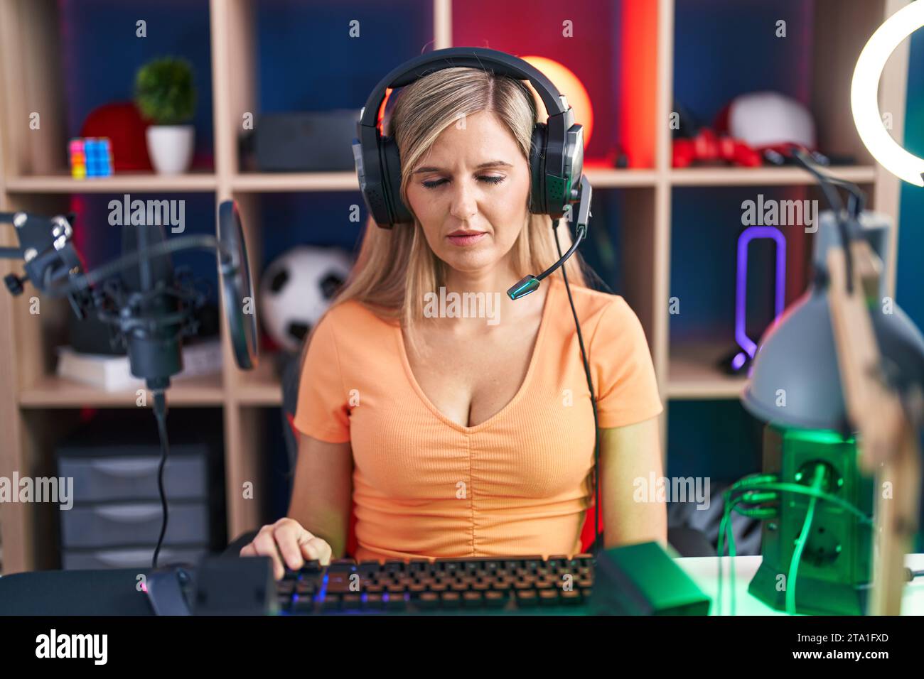 Tired female gamer playing video games hi-res stock photography and ...