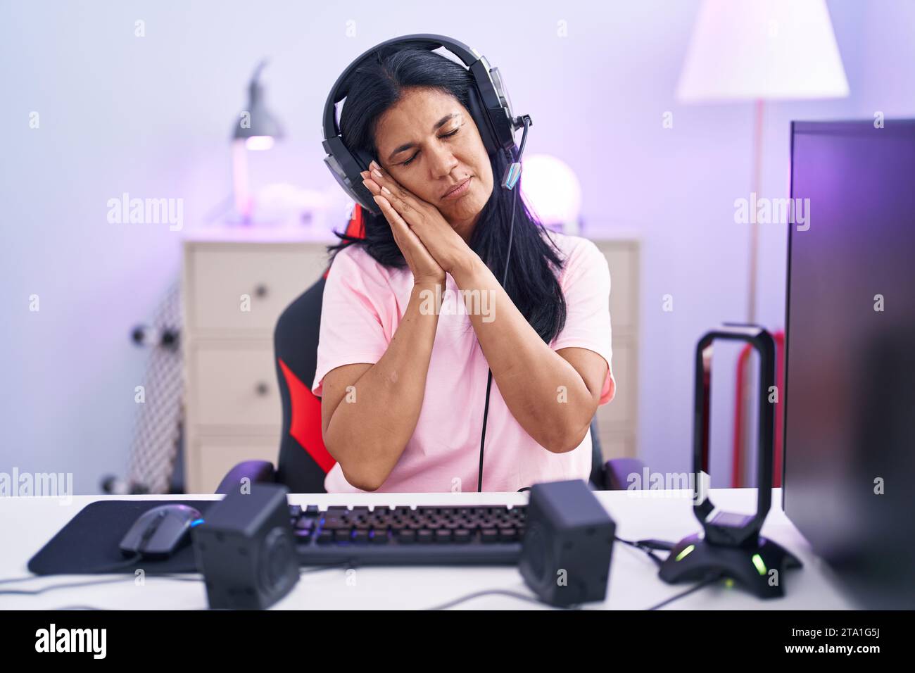 Tired female gamer playing video games hi-res stock photography and ...