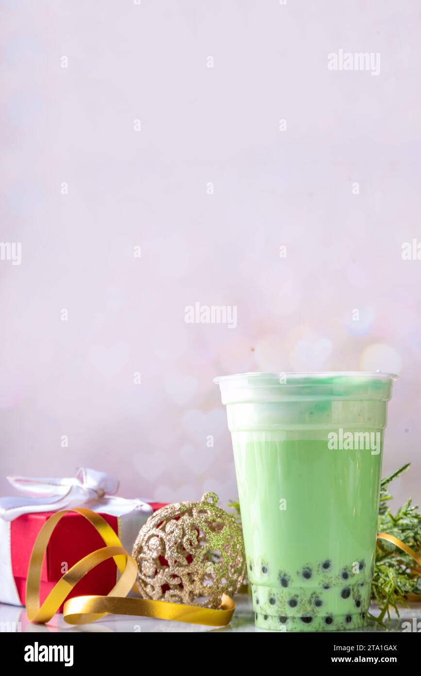 Green Christmas bubble tea drink, cold tasty sweet latte drink with ...