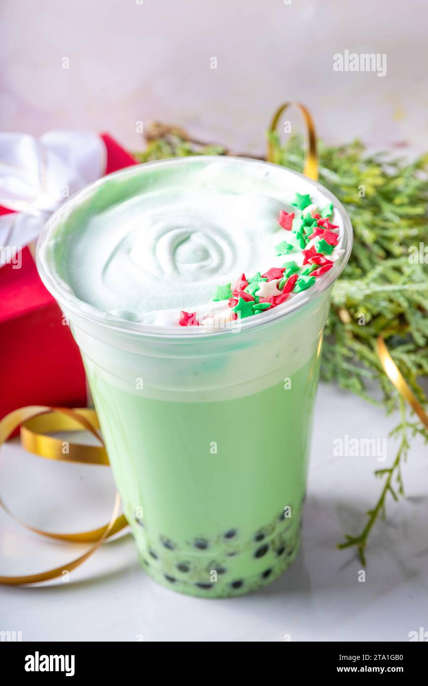 Green Christmas bubble tea drink, cold tasty sweet latte drink with ...