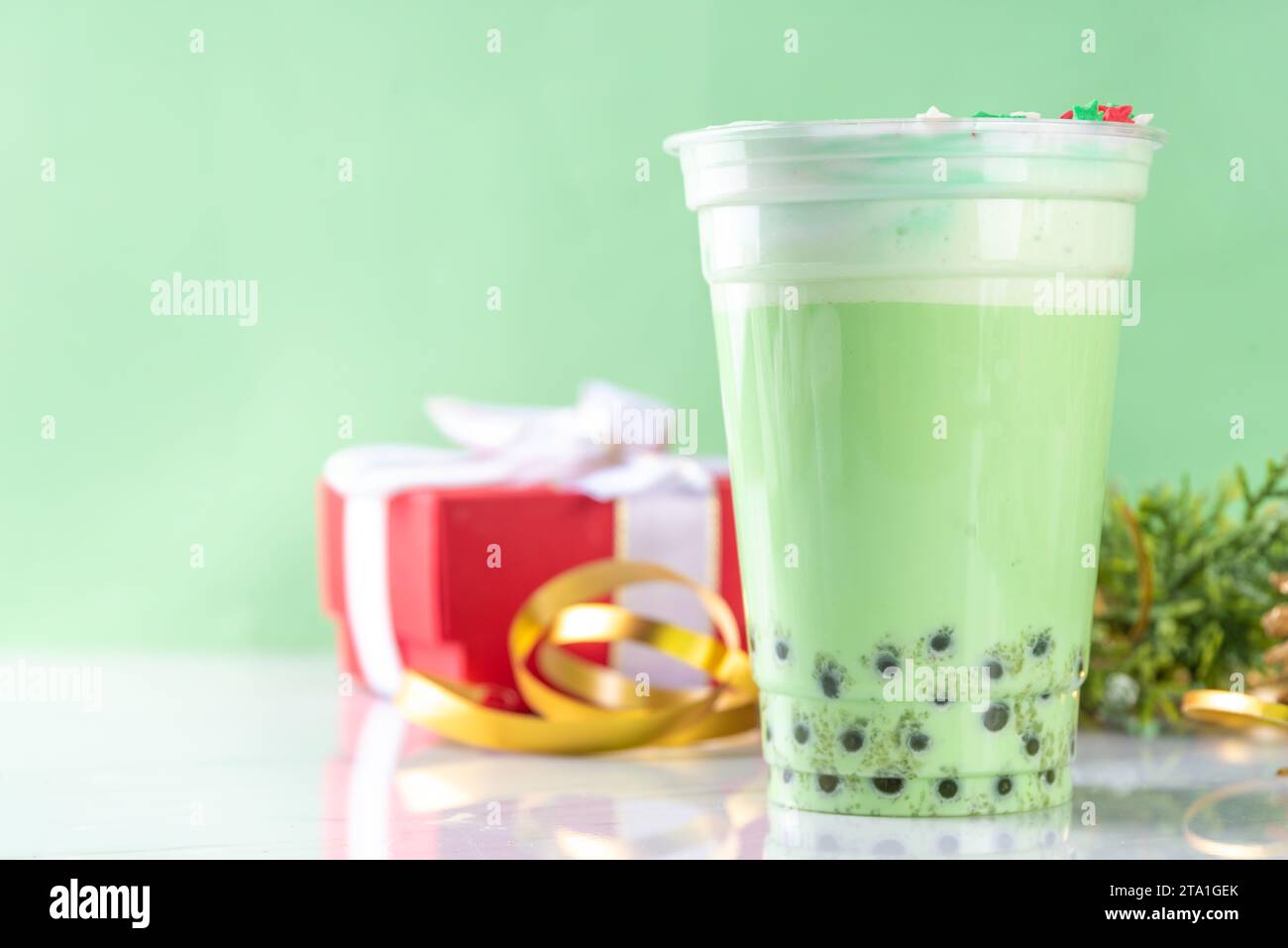 Green Christmas bubble tea drink, cold tasty sweet latte drink with ...
