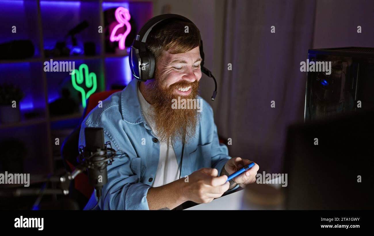Irish redhead gamer guy streaming a nighttime mobile game session ...