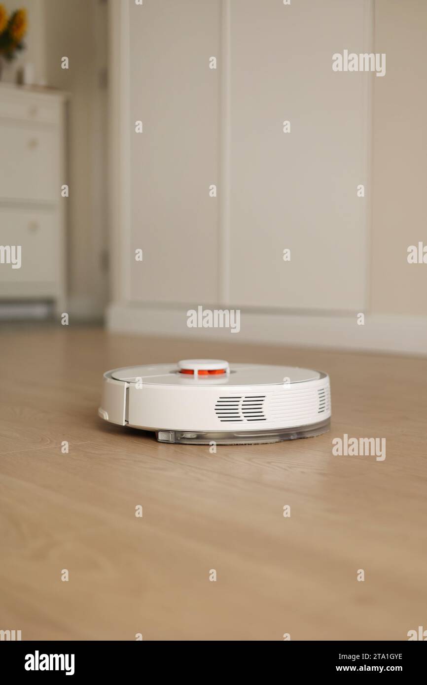 Modern wireless autonomous robotic vacuum cleaner cleans living room ...