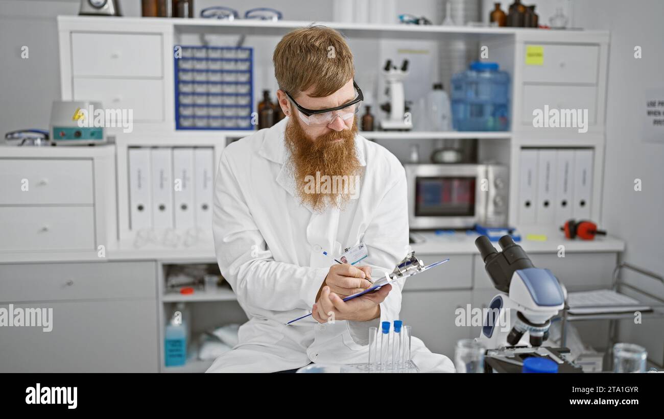 Male scientist takes notes on hi-res stock photography and images - Alamy