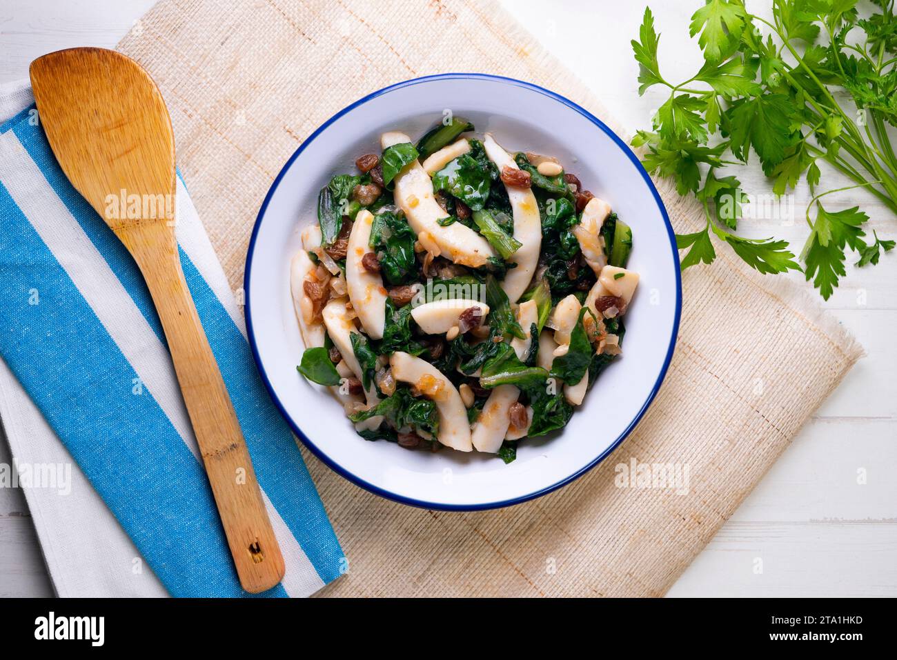 Cuttlefish cooked with chard and spinach. Spanish traditional tapas ...