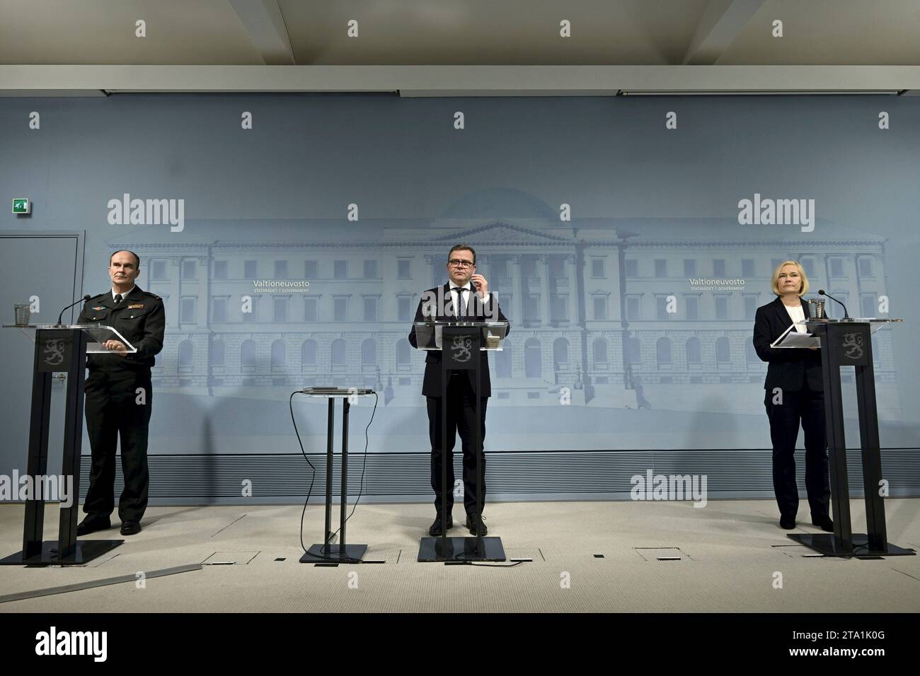 Finnish Prime Minister Petteri Orpo, center, Interior Minister Mari ...