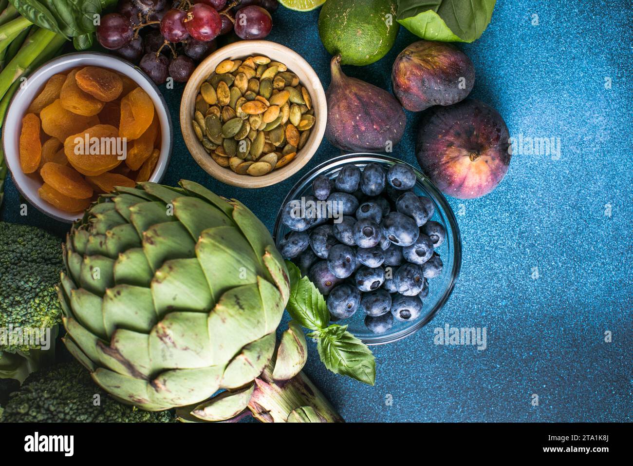 Variety of fresh raw organic fruits and vegetables. Health foods high ...