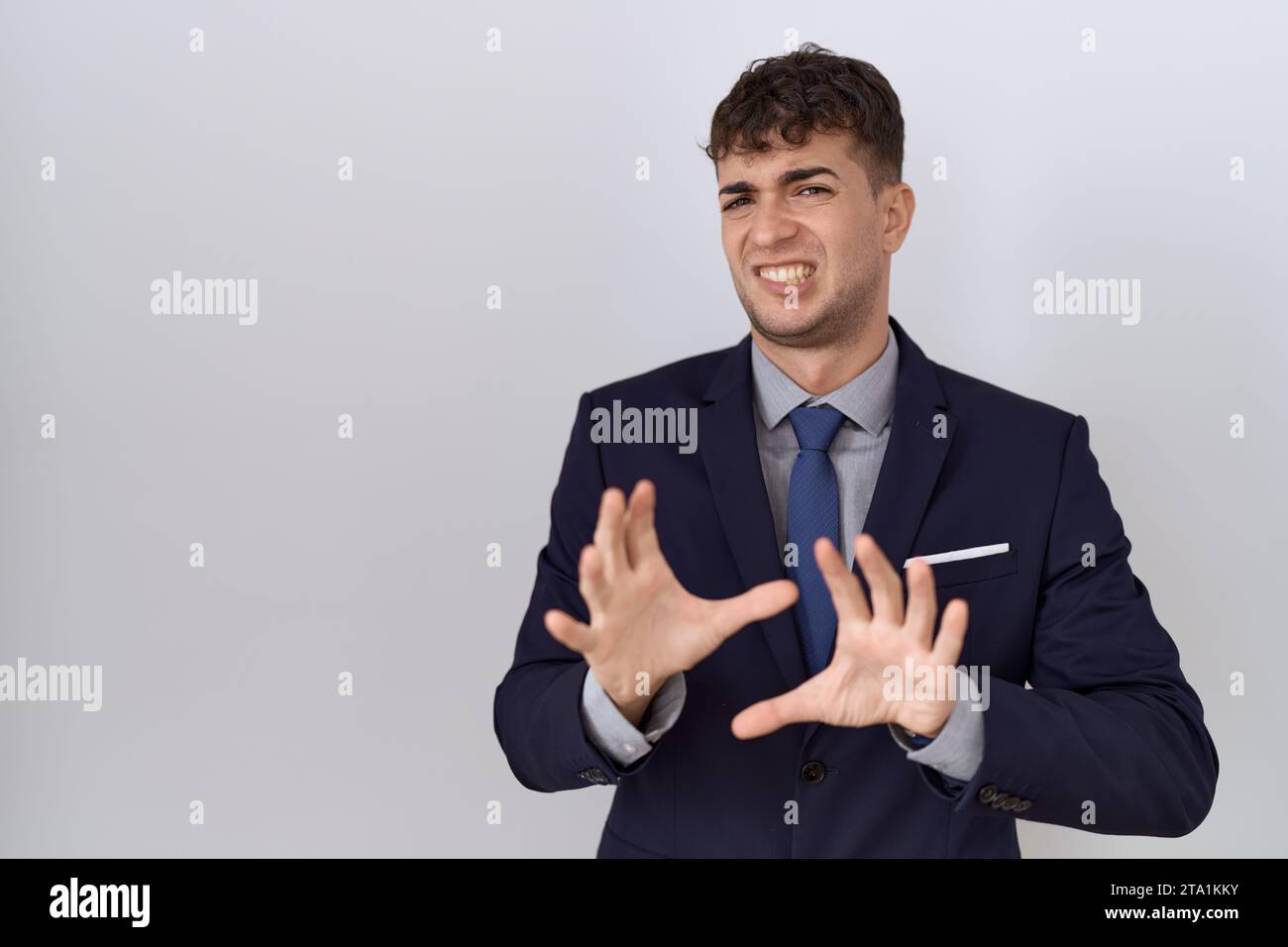 Young hispanic business man wearing suit and tie disgusted expression ...