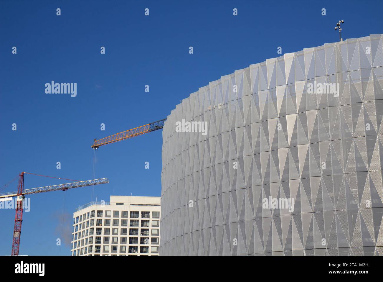 Construction of cast concrete houses. House frame and crane. The ...