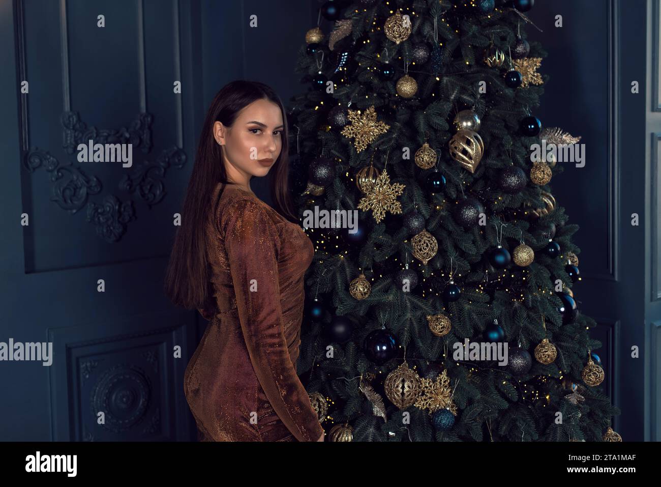 Photoshoot of a young girl in a brown dress Stock Photo - Alamy