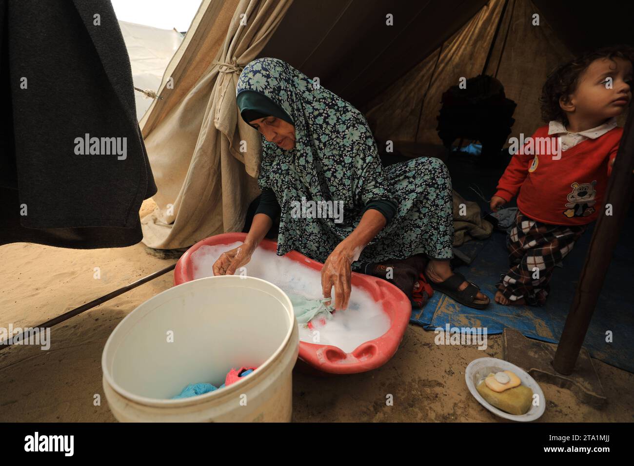 Displaced Palestinians, living in tents, struggle with cold weather ...