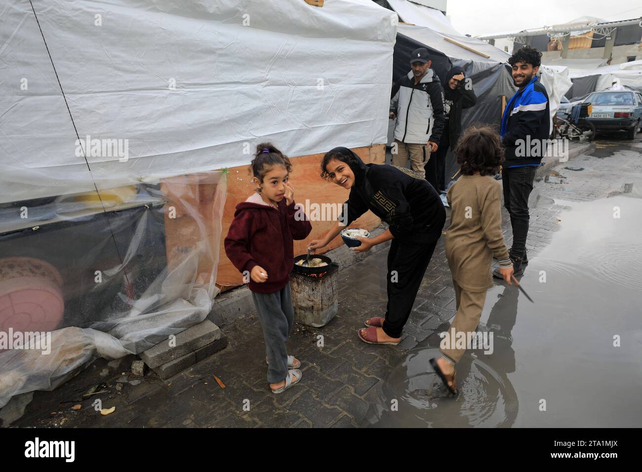 Displaced Palestinians, living in tents, struggle with cold weather ...