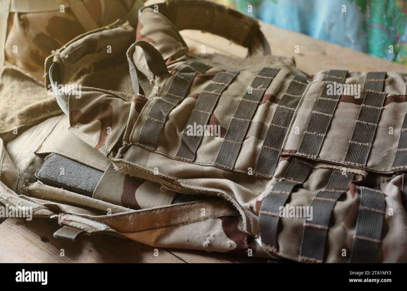 A military helmet of a Ukrainian soldier with a heavy bulletproof vest ...