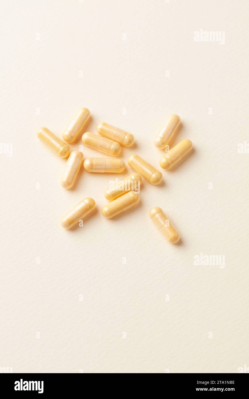 Coenzyme Q10 capsules. Dietary supplements. Bright paper background ...