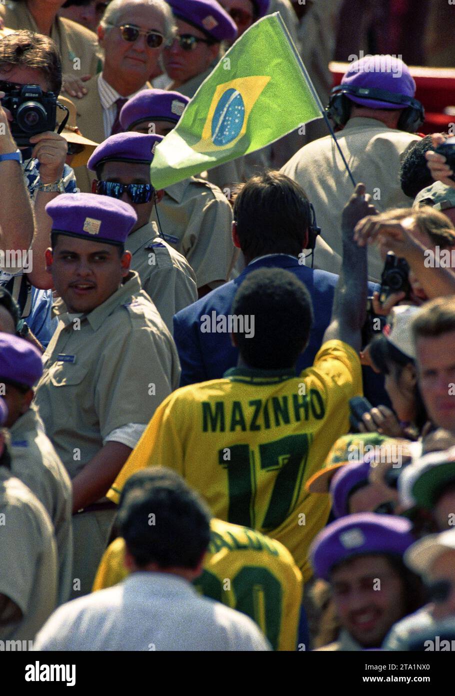 Brazilian soccer player Mazinho going up to the revewing stand to ...