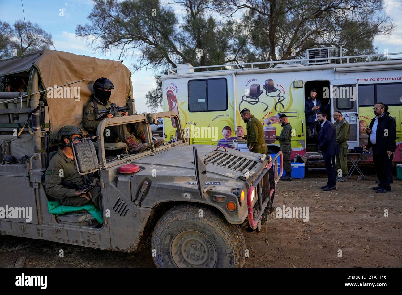 Israeli soldiers are seen at a staging area near the border with the ...