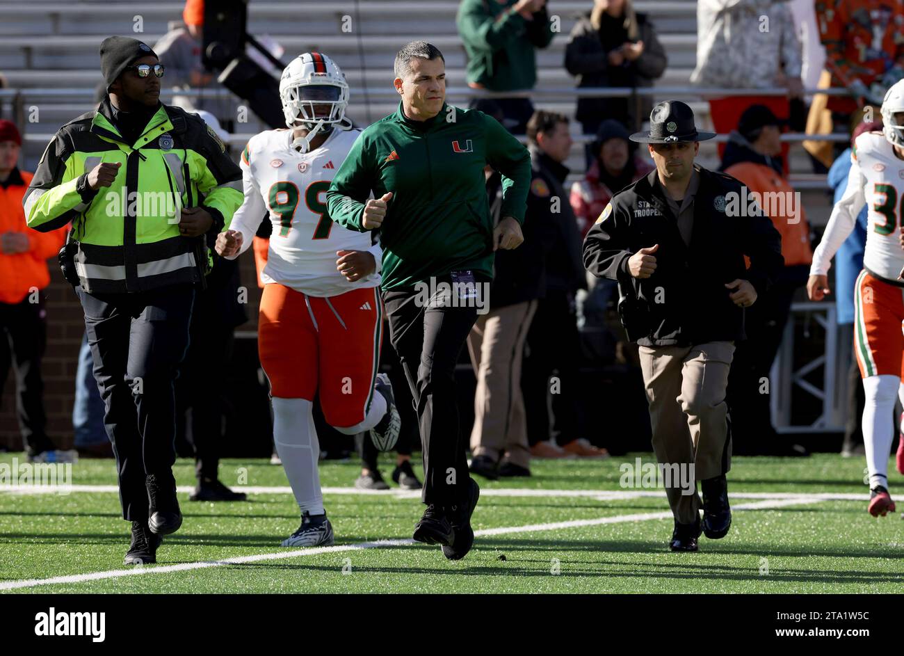 Miami football head coach Mario Cristobal enters the field before an ...