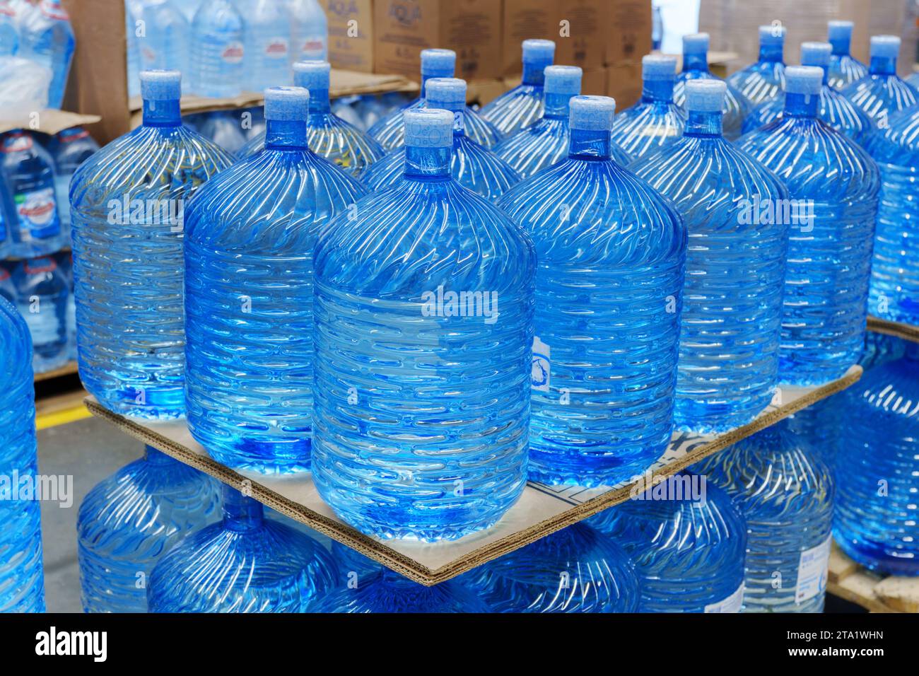 Bottles with clean water in a hyper package. Sale of drinking water ...