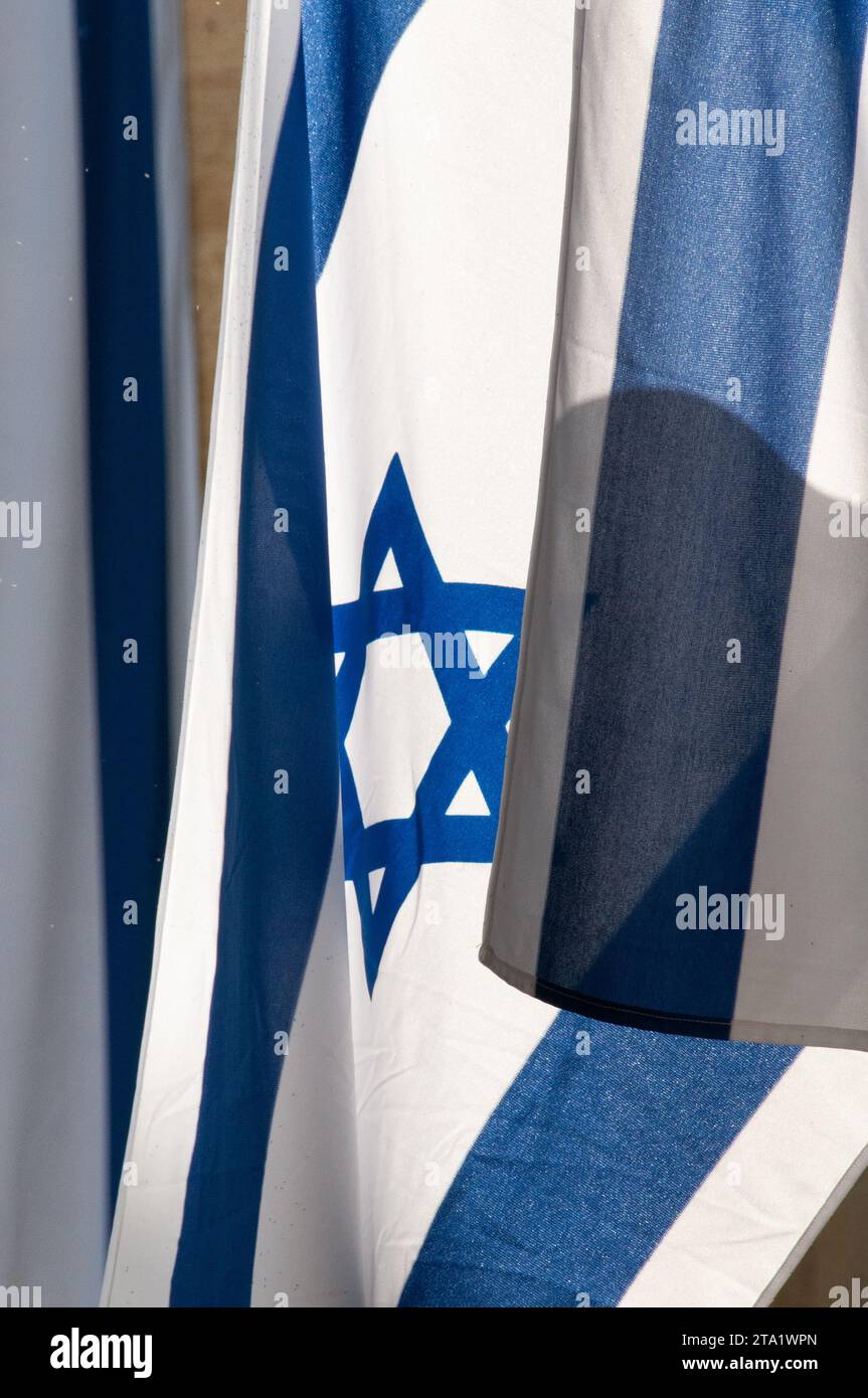 Closeup of the blue star and stripes of flags of the State of Israel ...