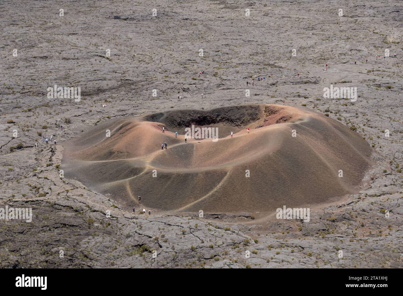 Hikers on an ancient crater of the Piton de la Fournaise volcano ...