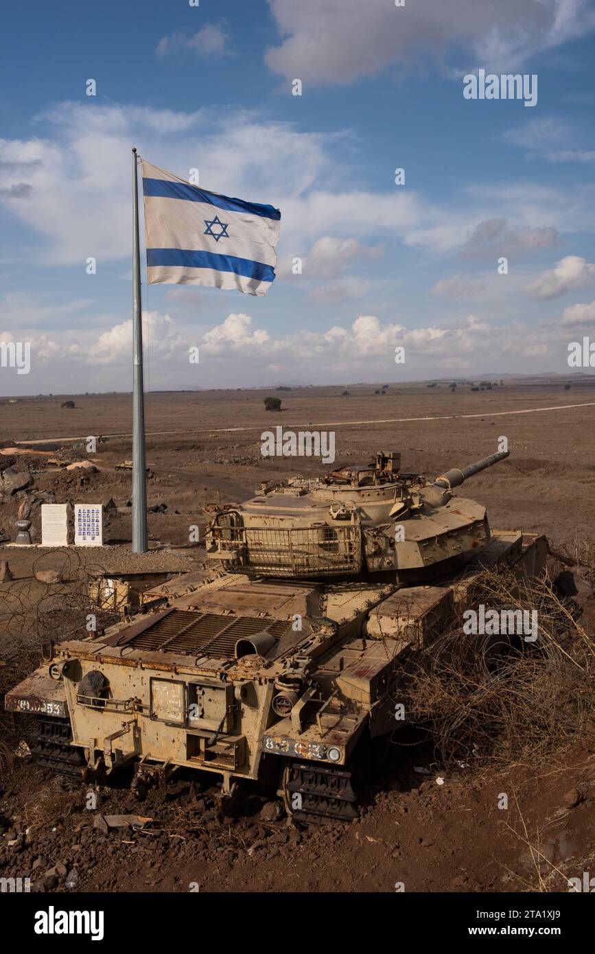 A large, blue and white flag of the State of Israel rippling in the ...