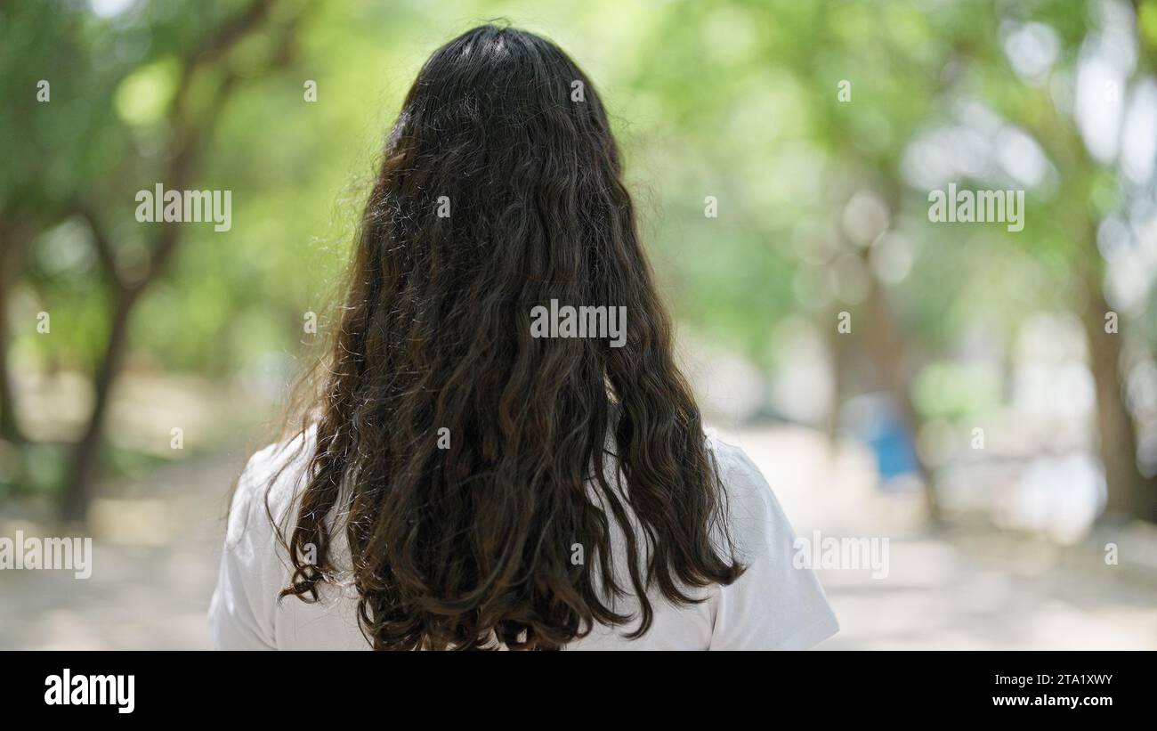 Woman standing backwards hi-res stock photography and images - Alamy