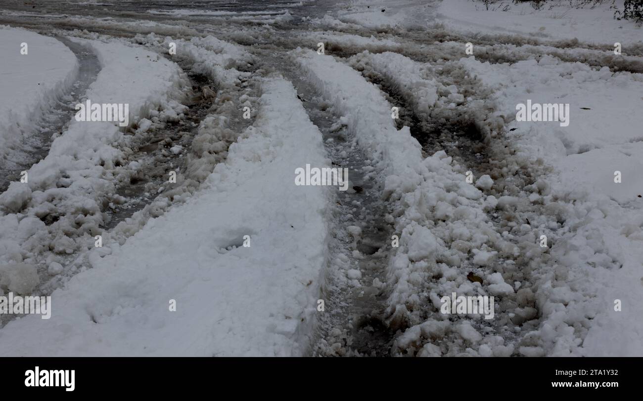 Snowy road in countryside. Drifts on an unplowed snow-covered country ...