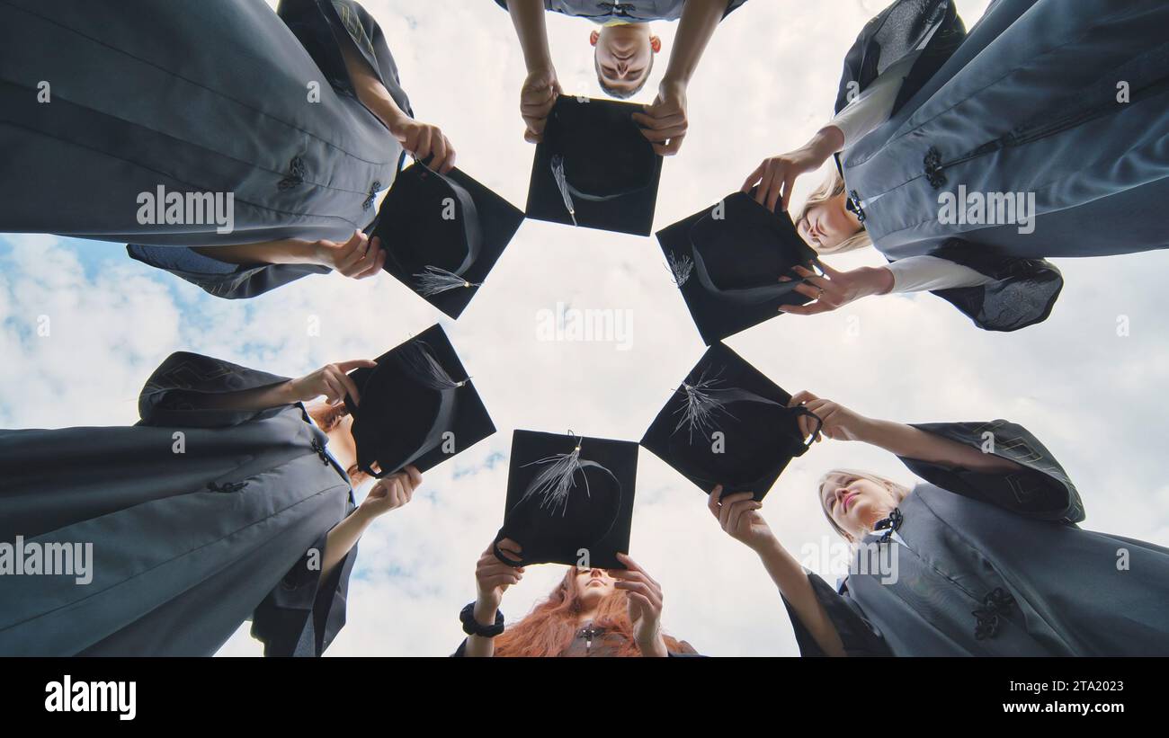 Graduates in robes caps hi-res stock photography and images - Alamy