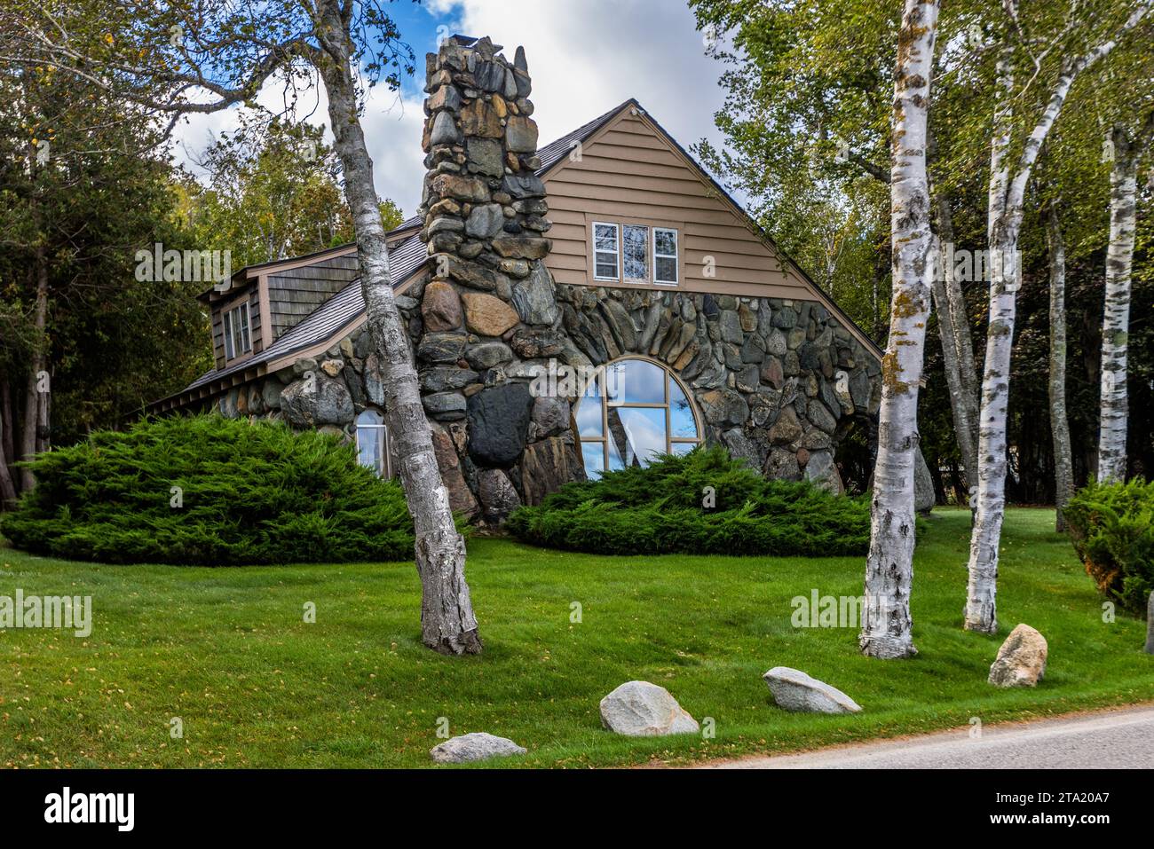 Stone house in Charlevoix. Earl A. Young with a fireplace made of large ...