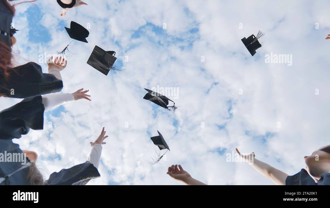 Graduation Caps Thrown in the Air Stock Photo - Alamy