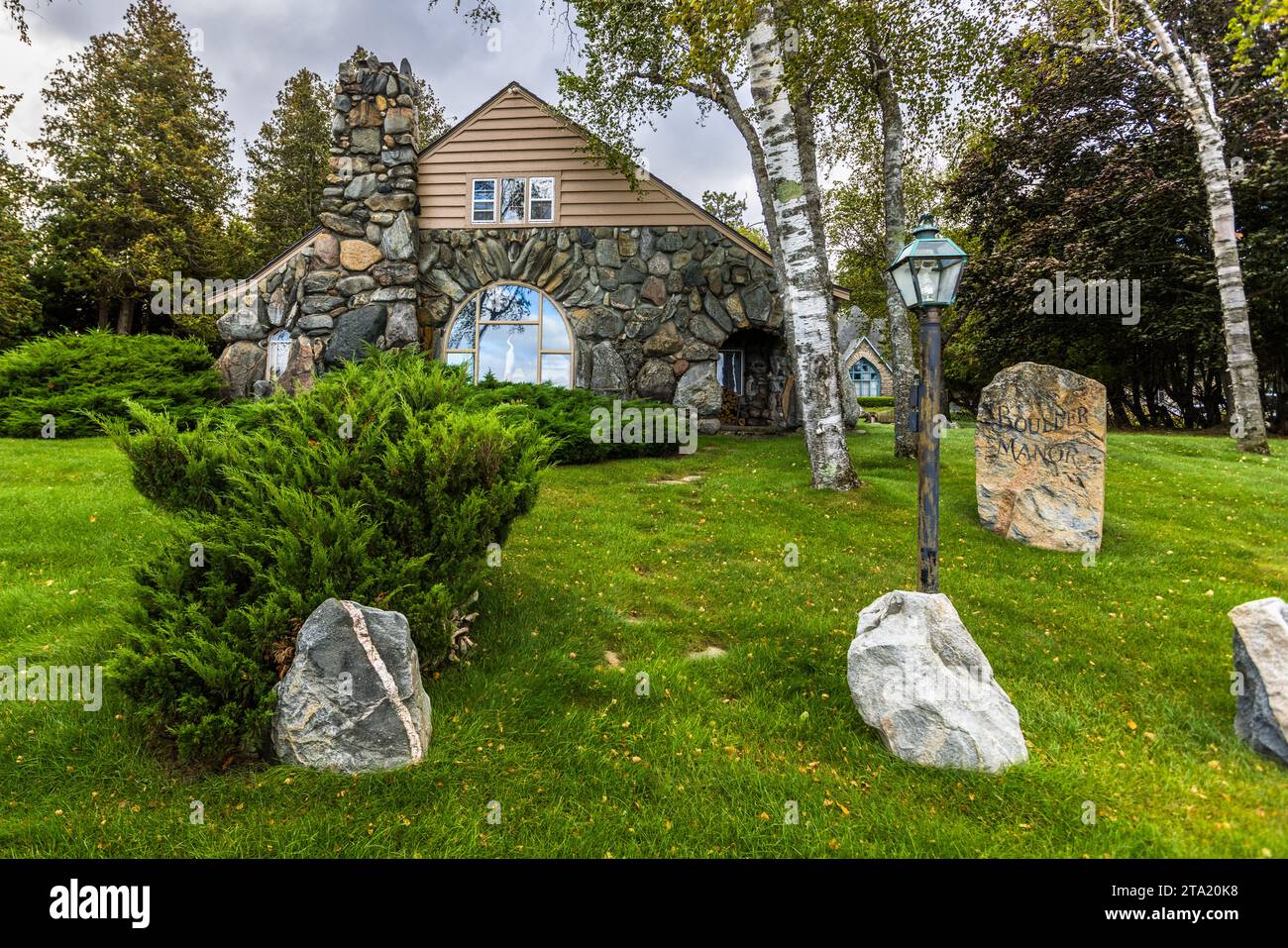 Stone house in Charlevoix. Earl A. Young with a fireplace made of large ...