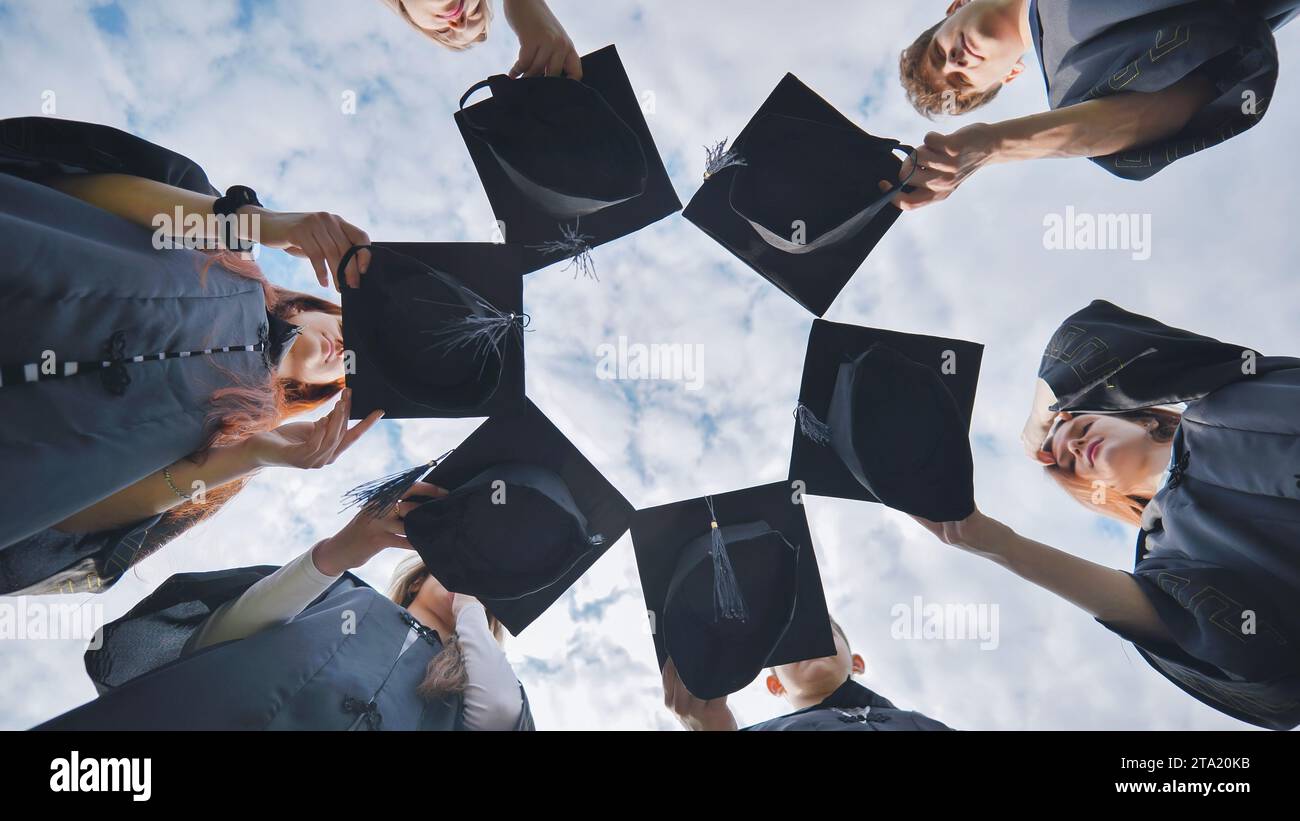 Graduates in robes caps hi-res stock photography and images - Alamy