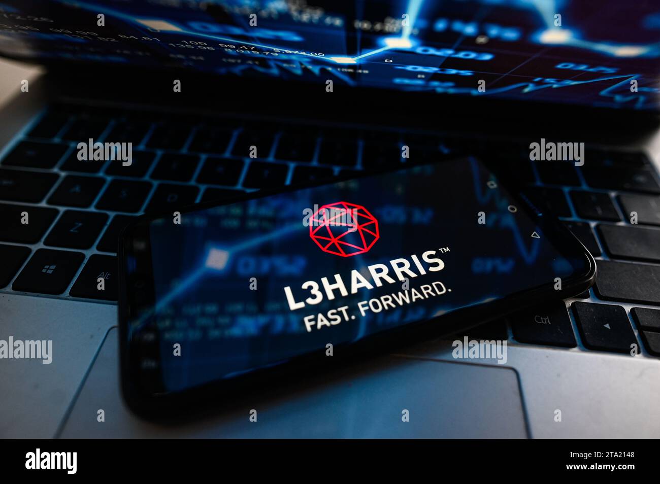 In this photo illustration, the L3 Harris logo seen displayed on a ...