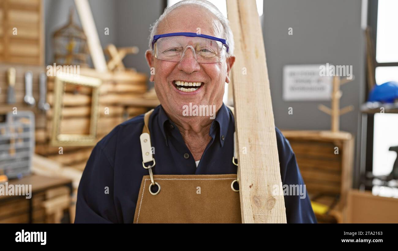 Confident senior man, a professional carpenter, smiling while securely ...