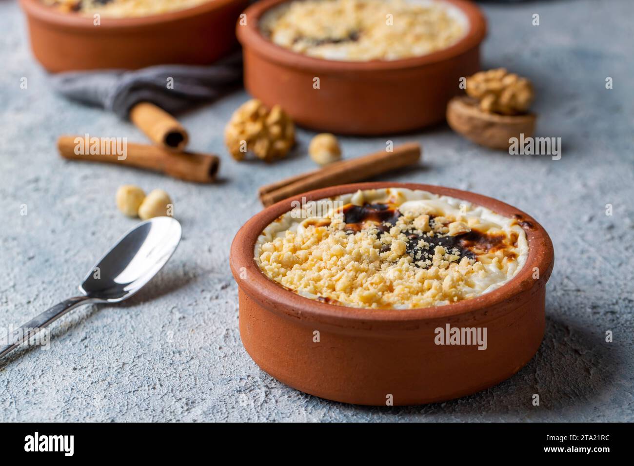 Baked rice pudding turkish milky dessert sutlac in earthenware ...