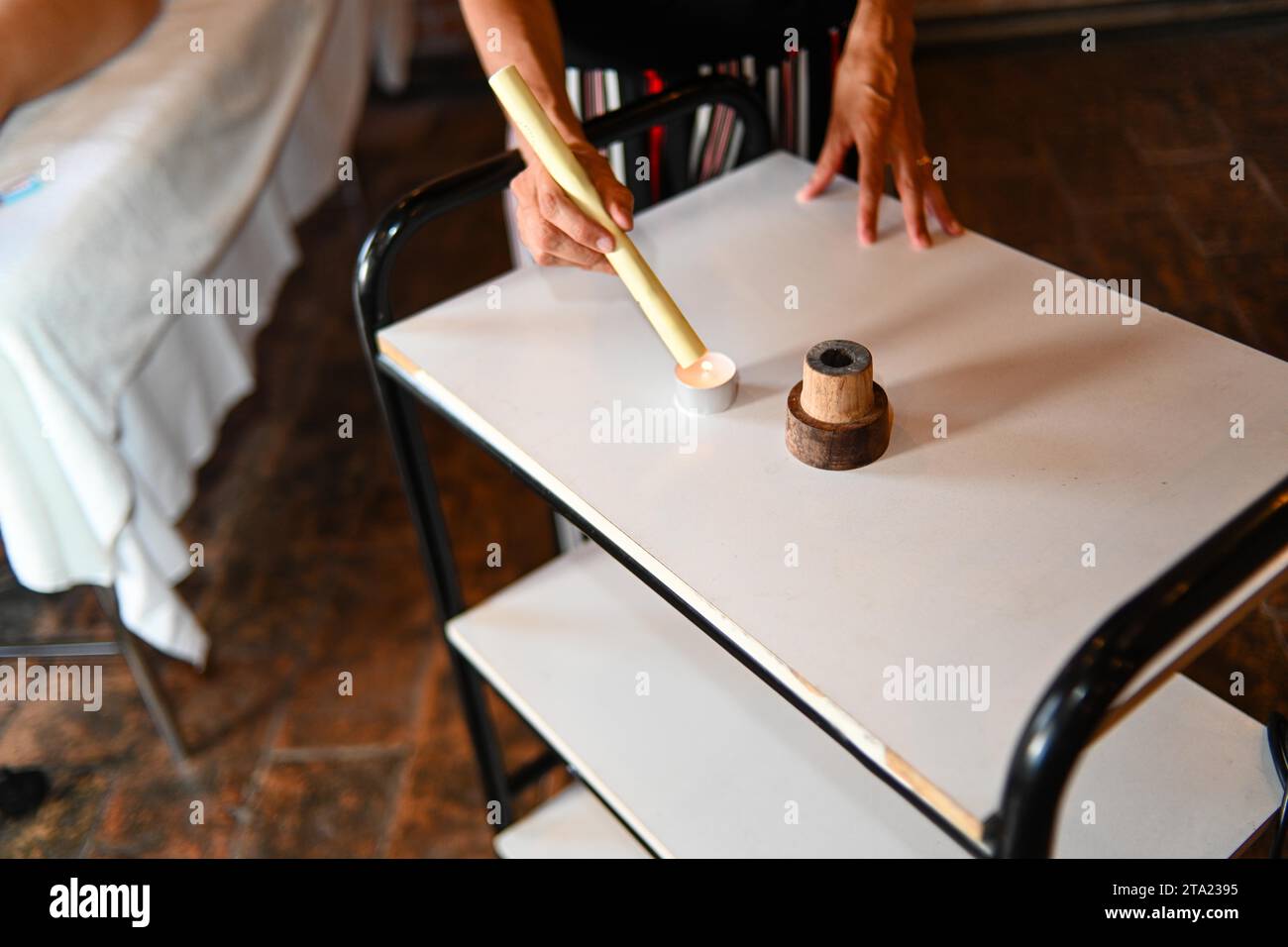 Therapist apply abdominal moxibustion chinese smoking stick moxa ...