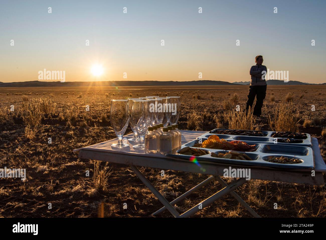 Table with glasses and snacks for the sundowner, Namib Desert, Namib ...