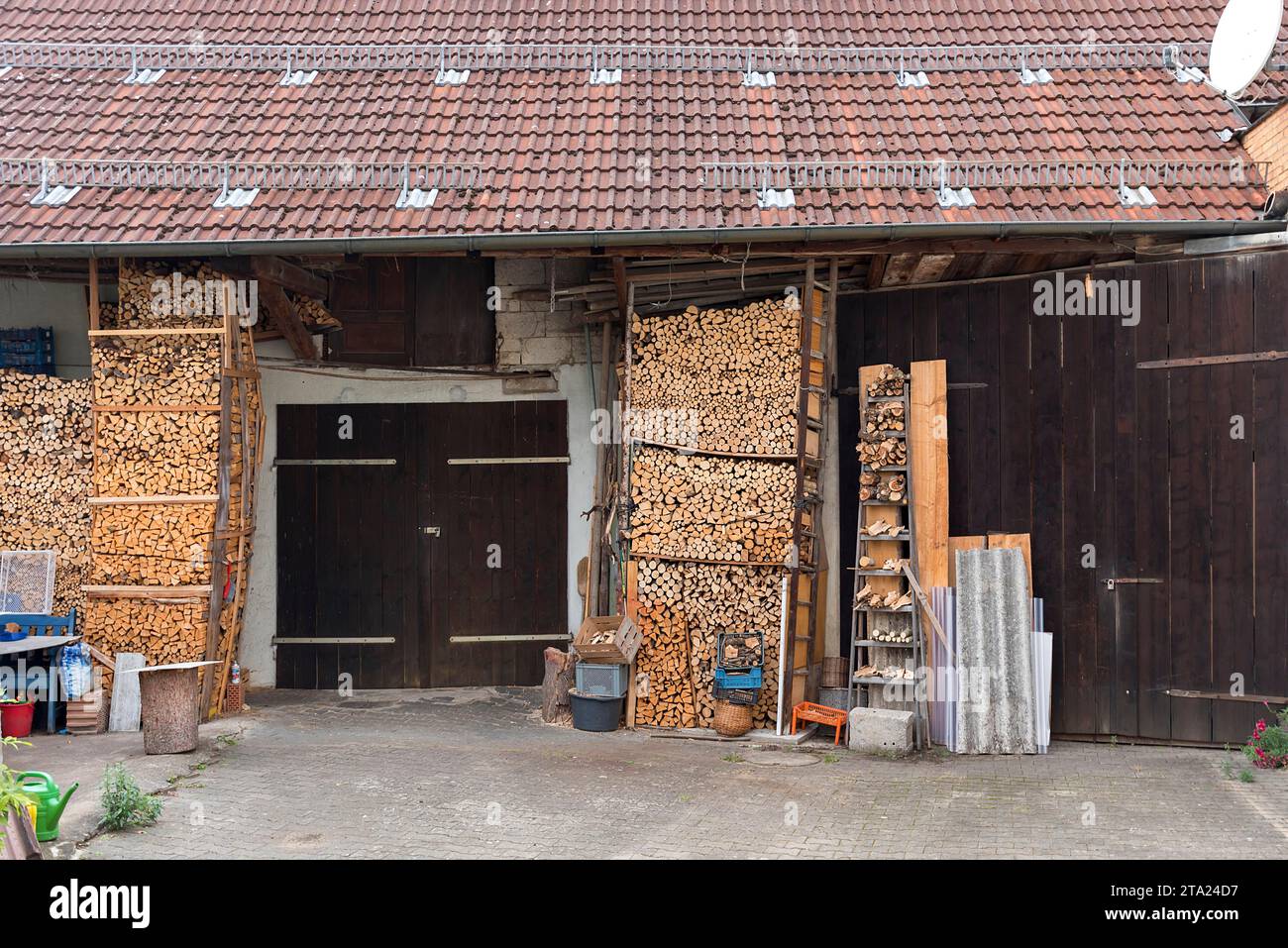Stacked firewood on a farm, Franconia, Bavaria, Germany Stock Photo - Alamy
