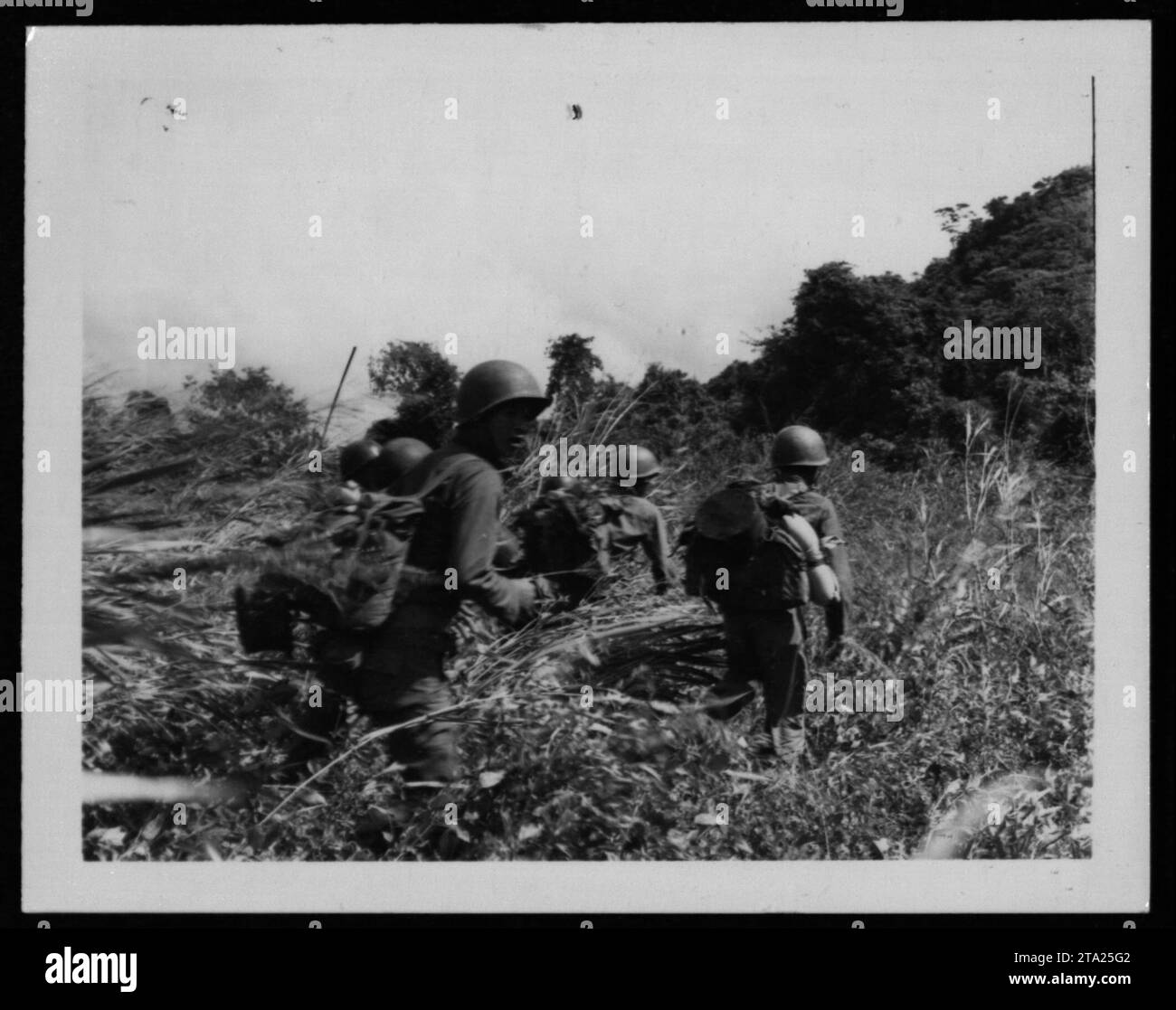 ARVN soldiers are patrolling a village in South Vietnam on November 28, 1963, during the Vietnam ...