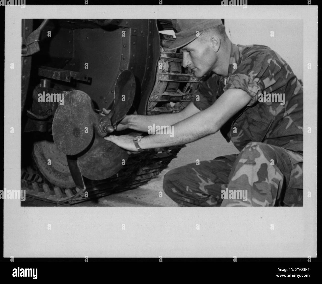 American soldiers engage in maintenance activities during the Vietnam ...