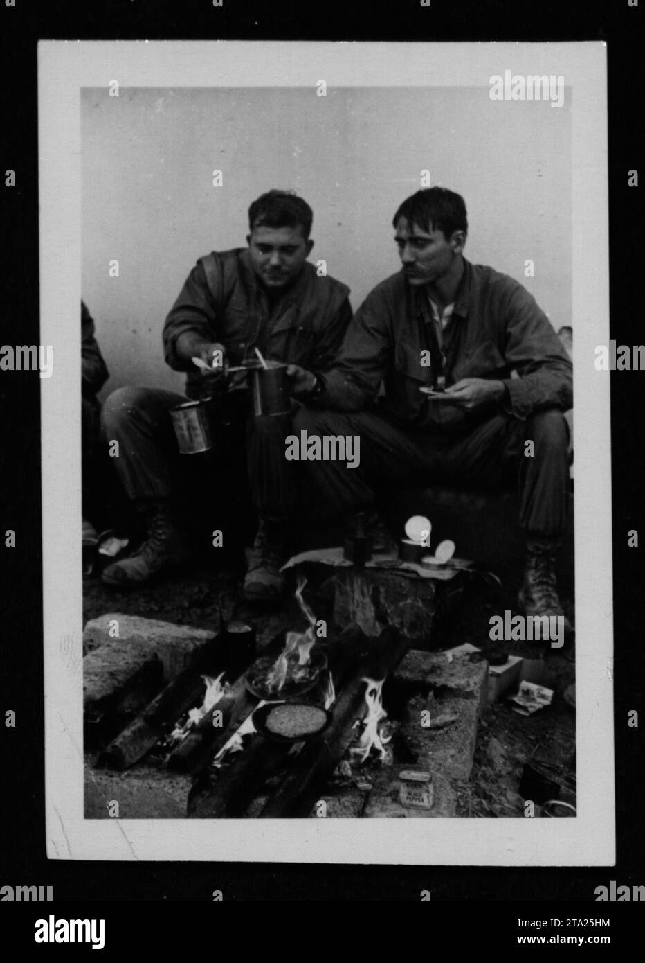 American soldiers enjoying a meal at a military base in Vietnam during ...