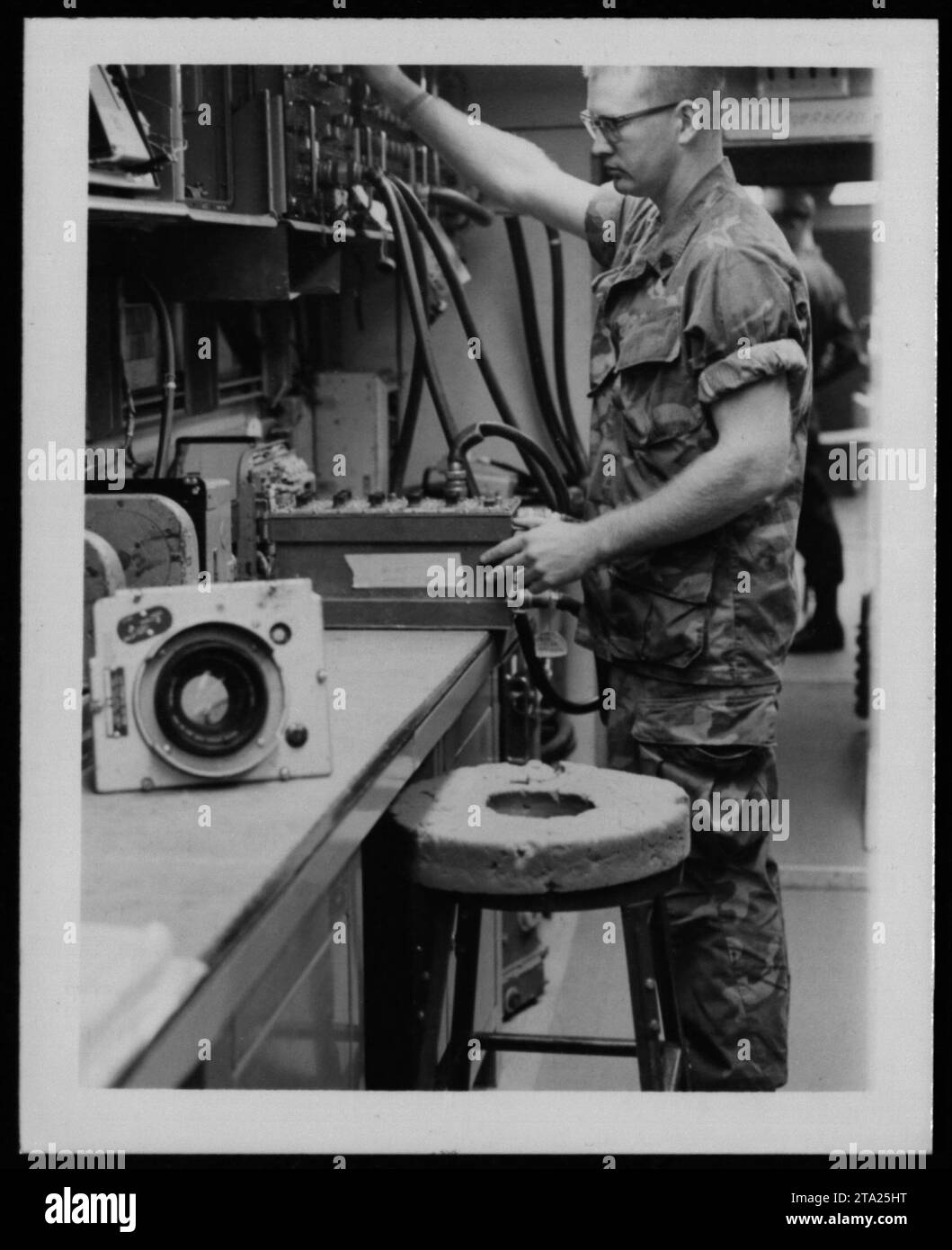 American servicemen conduct maintenance on military equipment during ...