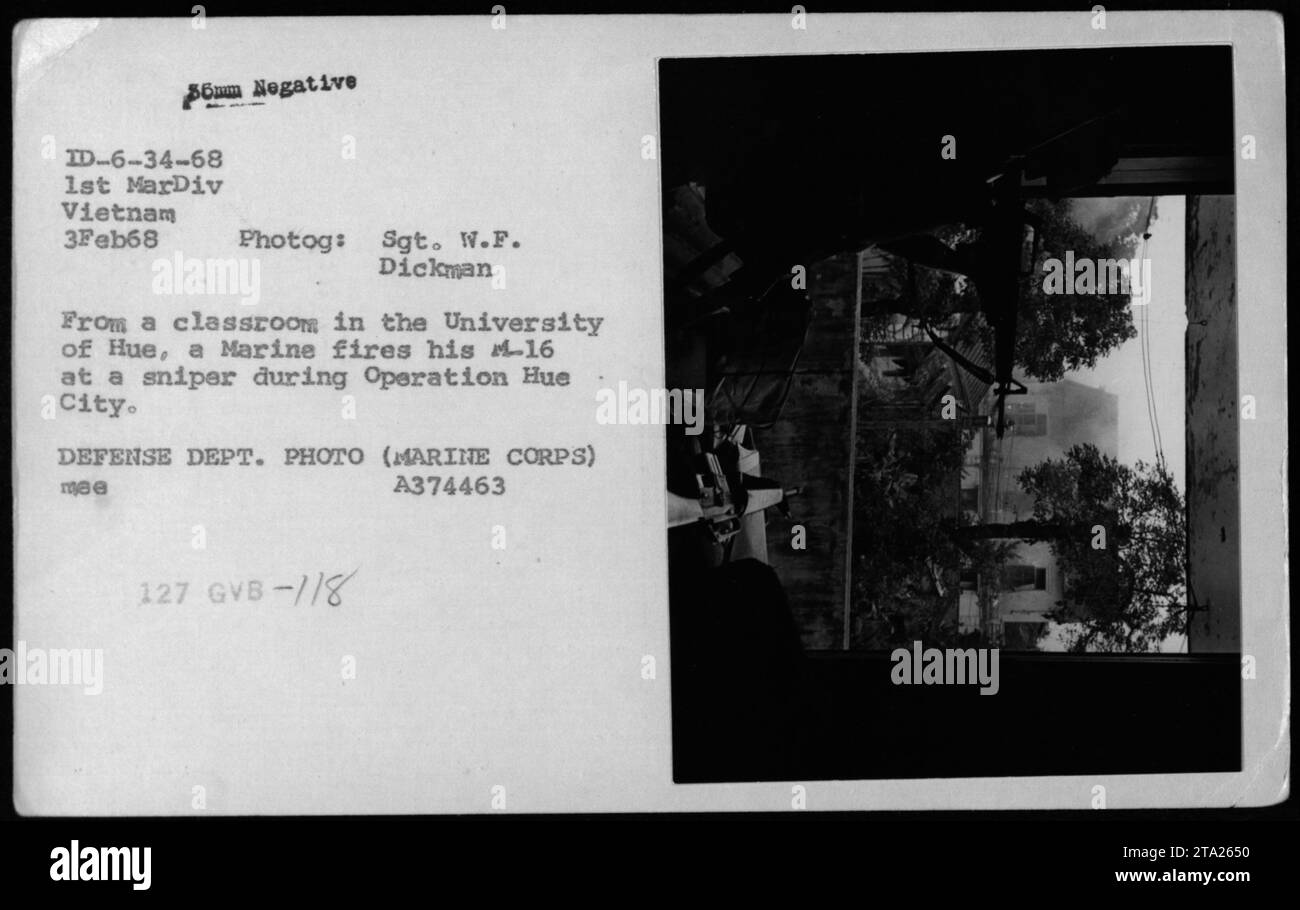 A Marine engages a sniper from a classroom in the University of Hue ...