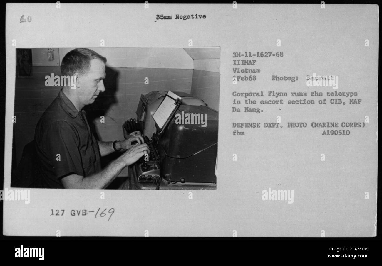 Marine Corporal Flynn runs the teletype in the escort section of CIB, MAF Da Nang on February 1 ...