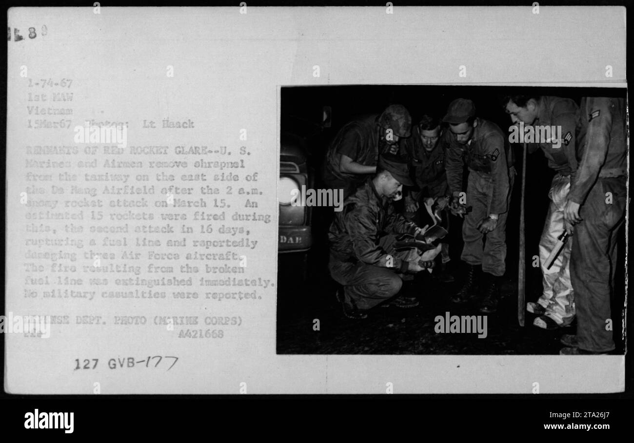 Photograph of U.S. Marines and Airmen clearing debris and shrapnel from ...