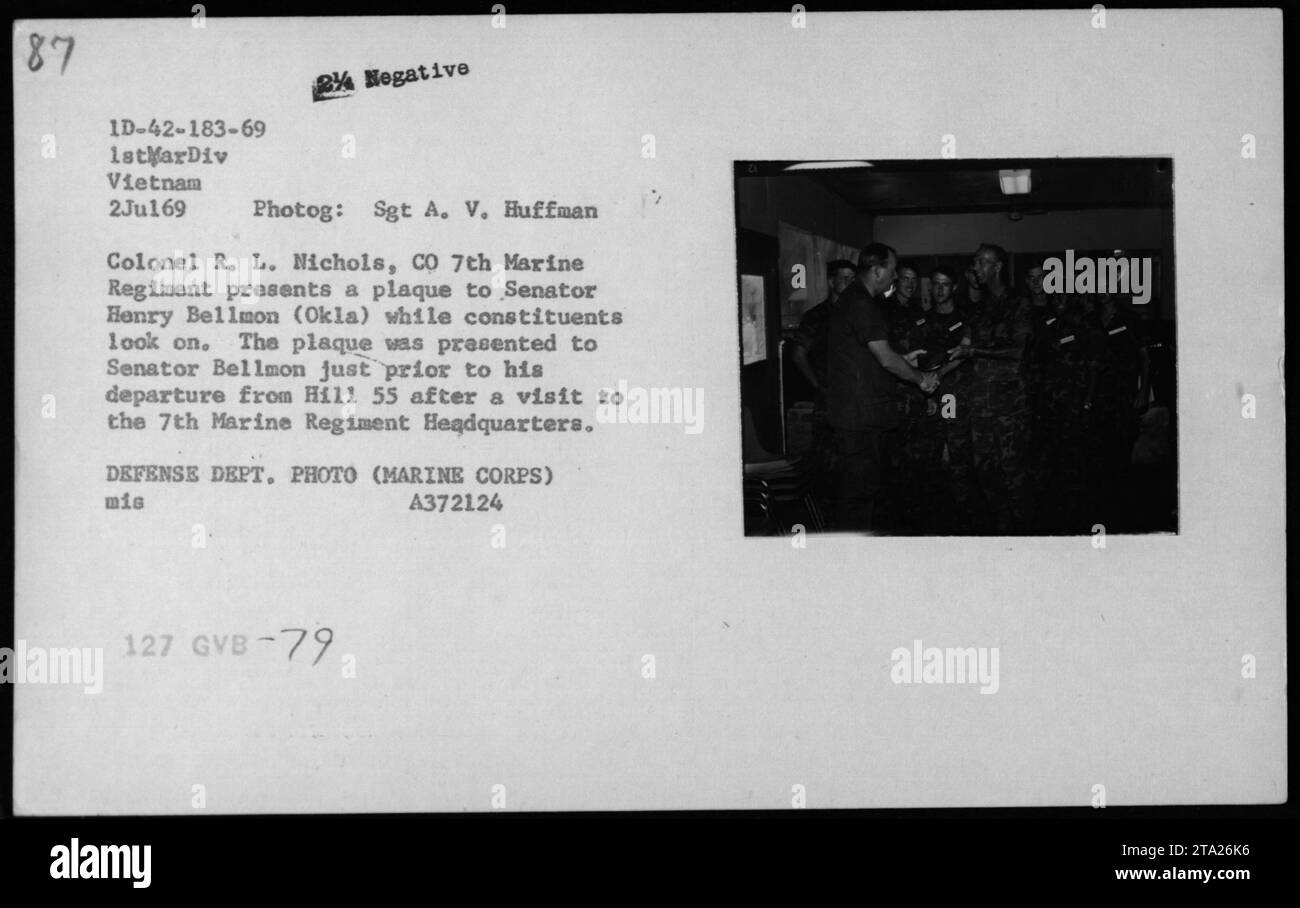 Senator Henry Bellmon receiving a plaque from Colonel R.L. Nichols, CO ...